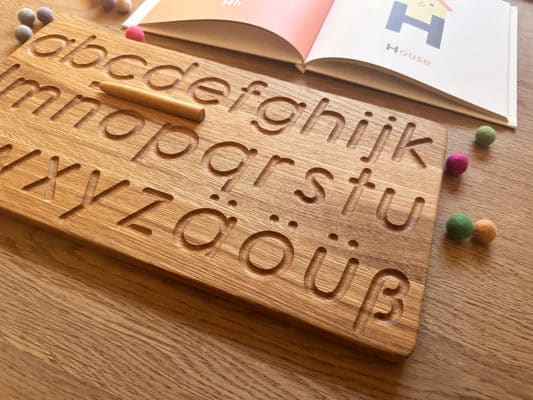 Reversible wooden alphabet tracing board: German - Threewood